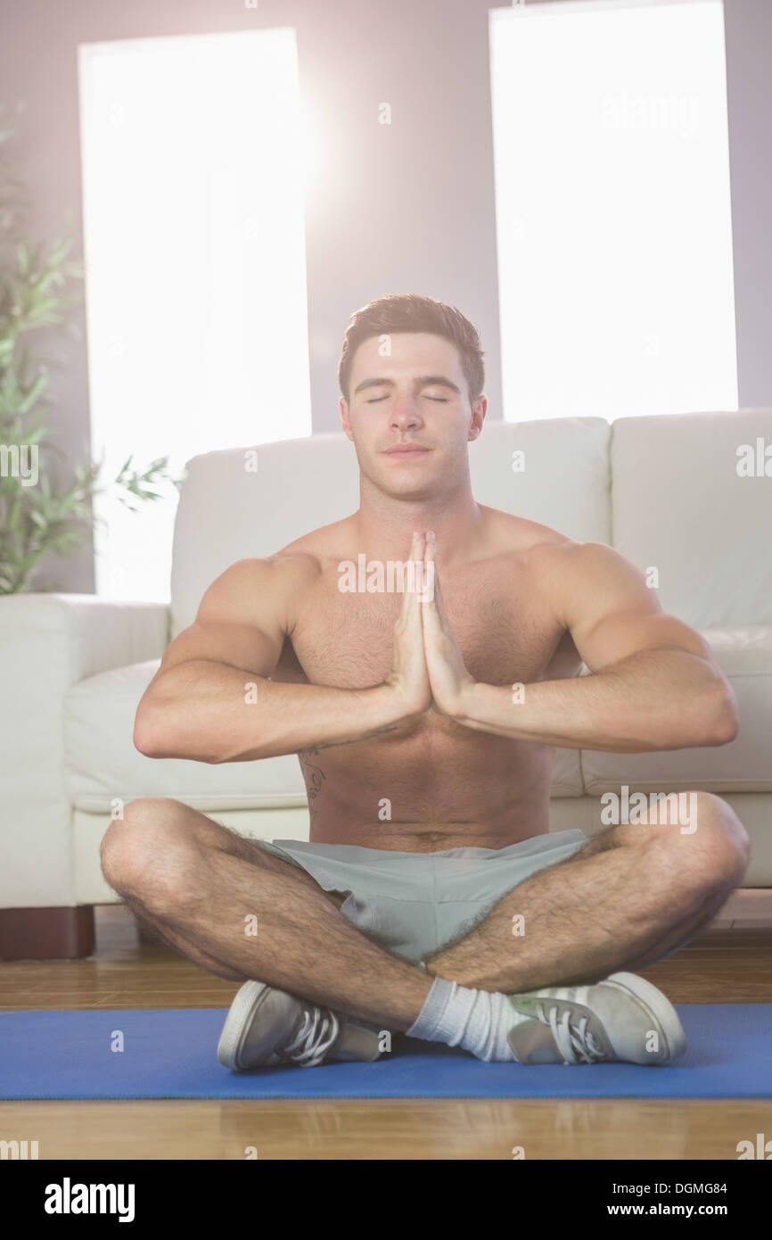 Calm handsome man meditating Stock Photo - Alamy