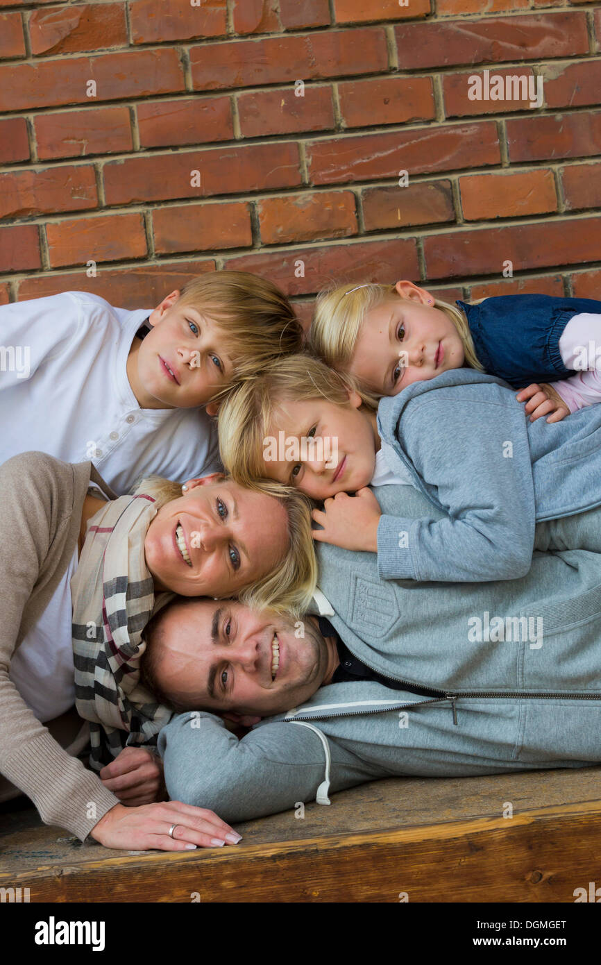Family portrait with three children, stacked Stock Photo - Alamy