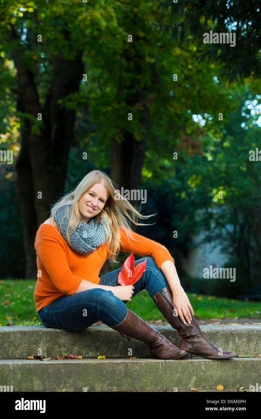Young woman sitting stone steps outdoors hi-res stock photography and ...