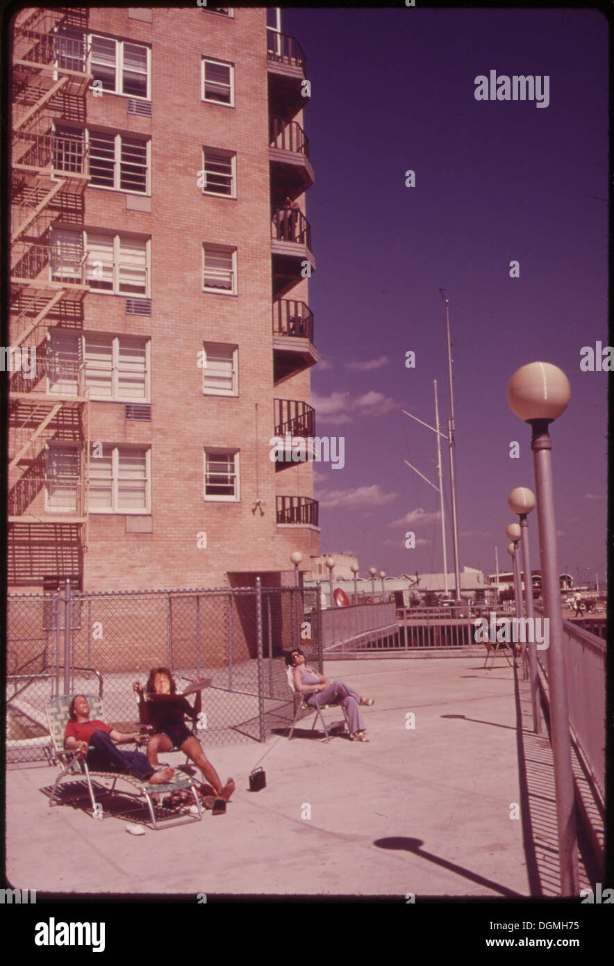 A luxury high-rise building stands along the waterfront at Sheepshead ...