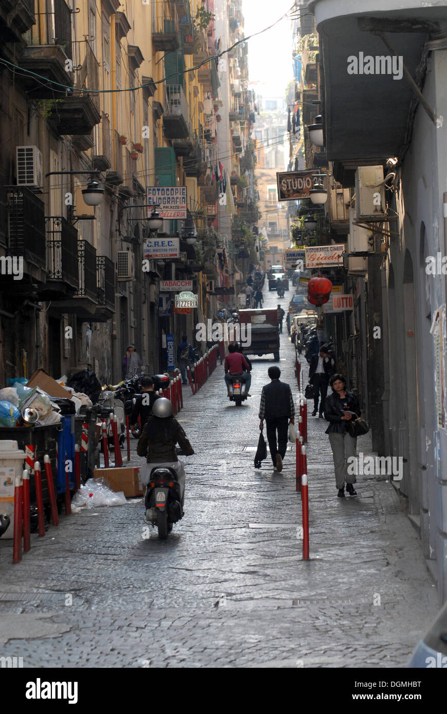 Narrow street with traffic in the old Naples, Italy, Europe Stock Photo ...