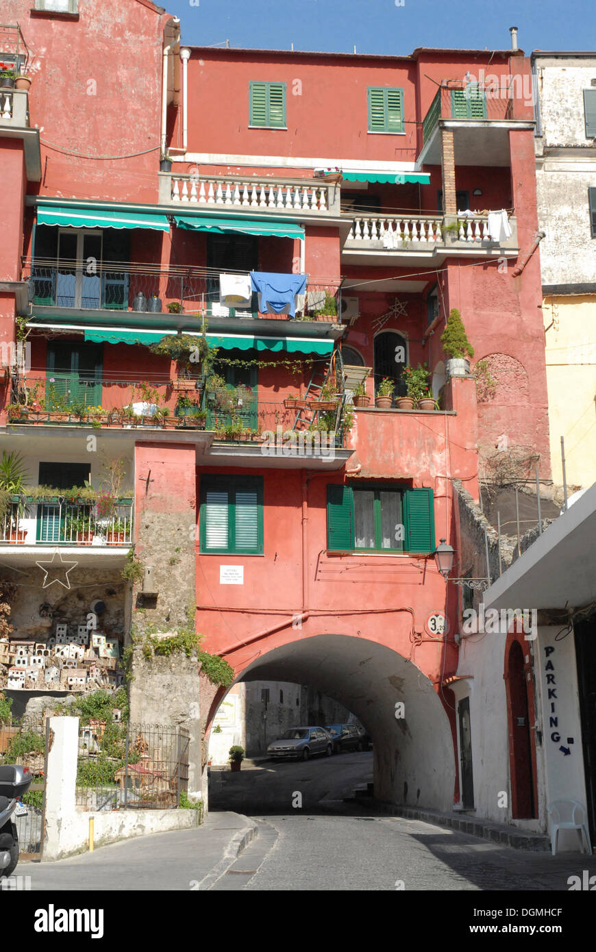 Typical Italian red old house with balconies and an archway in Amalfi ...