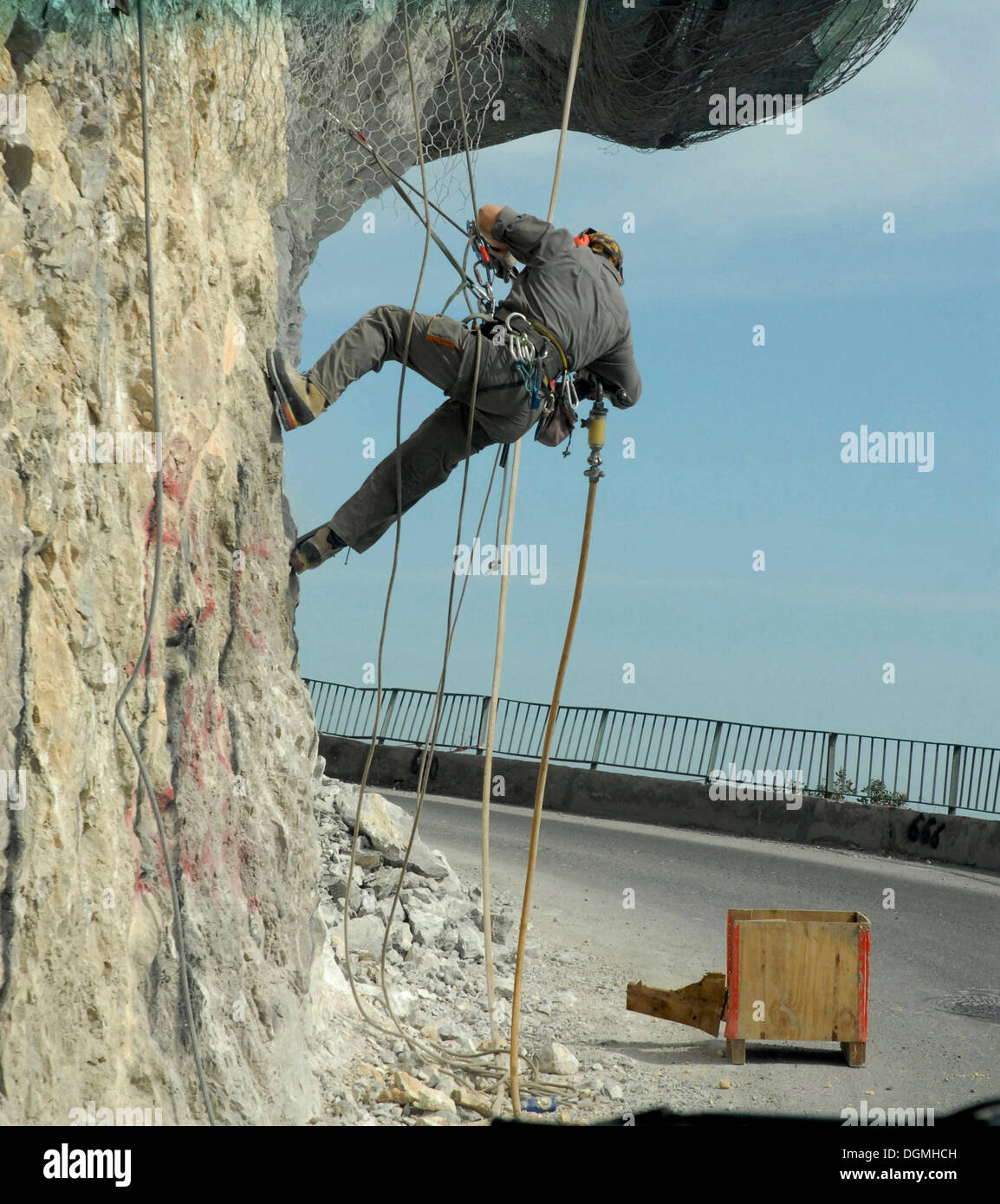 Road worker climbing a mountain side at Capri, Italy, Europe Stock ...