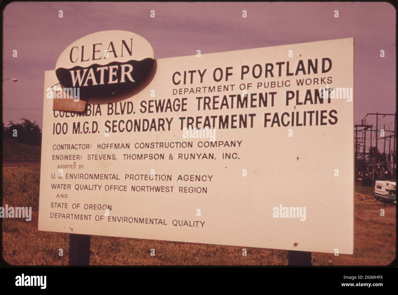 A sign marking the entrance to a city sewage treatment plant ...