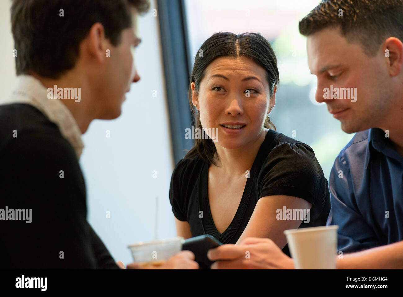 Group of men meeting at a coffee shop hi-res stock photography and ...