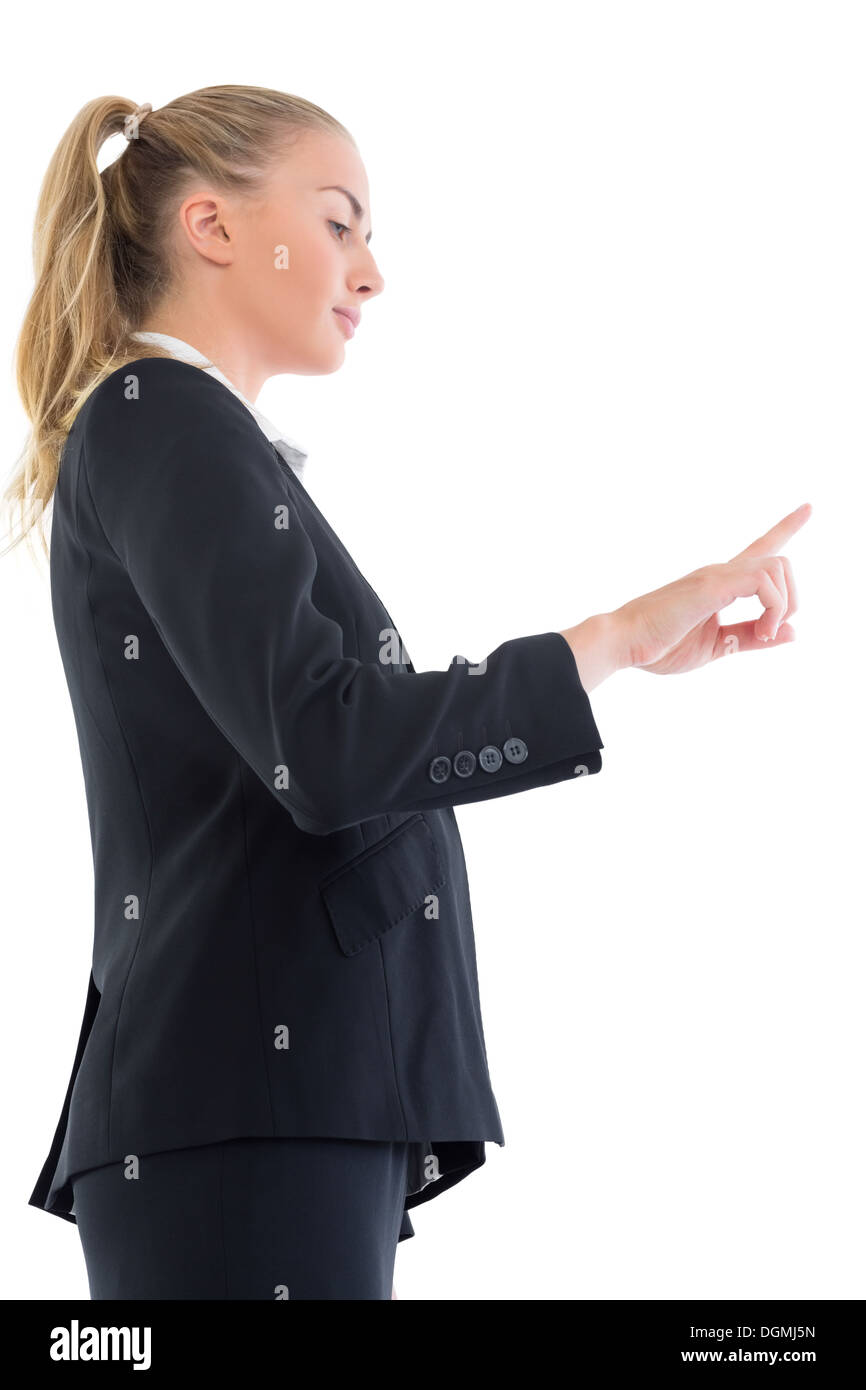 Low angle side view of blonde businesswoman pointing upwards Stock ...