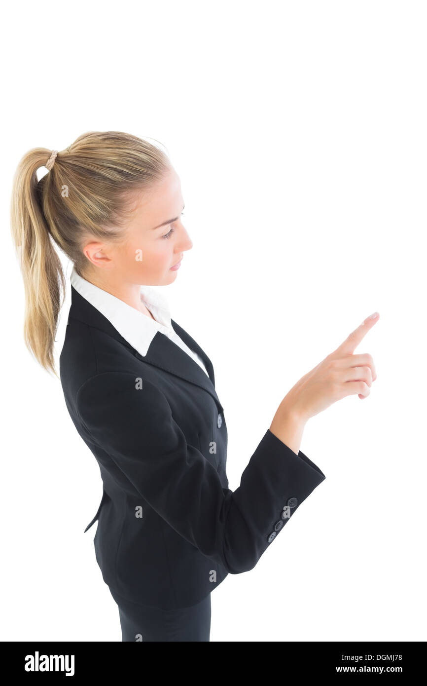 Blonde ponytailed business woman pointing Stock Photo - Alamy