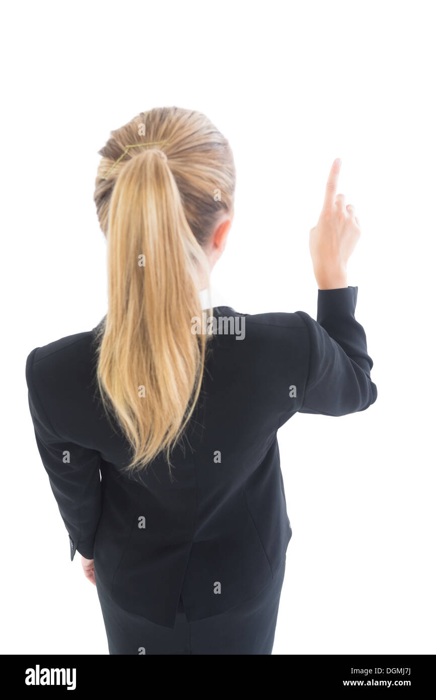 Ponytailed business woman pointing Stock Photo - Alamy