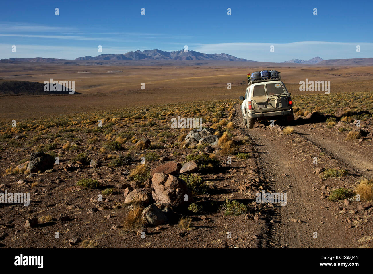 Off-road vehicle on a gravel road, Atacama Desert, Altiplano, southern ...