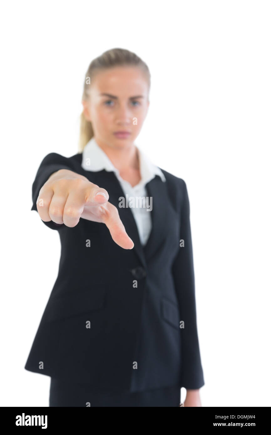 Attractive businesswoman pointing at camera Stock Photo - Alamy
