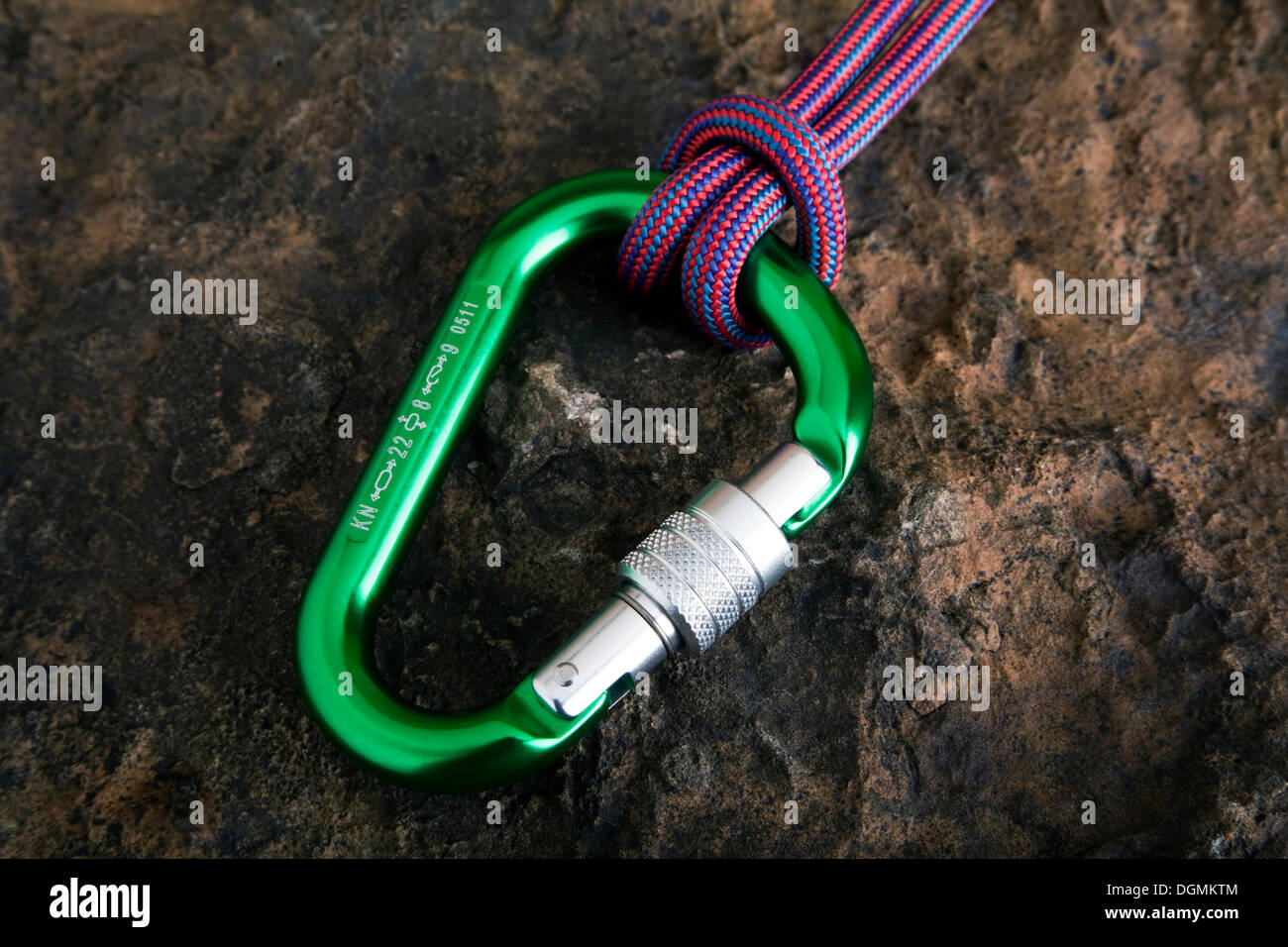 Carabiner with safety rope on a stone surface Stock Photo - Alamy