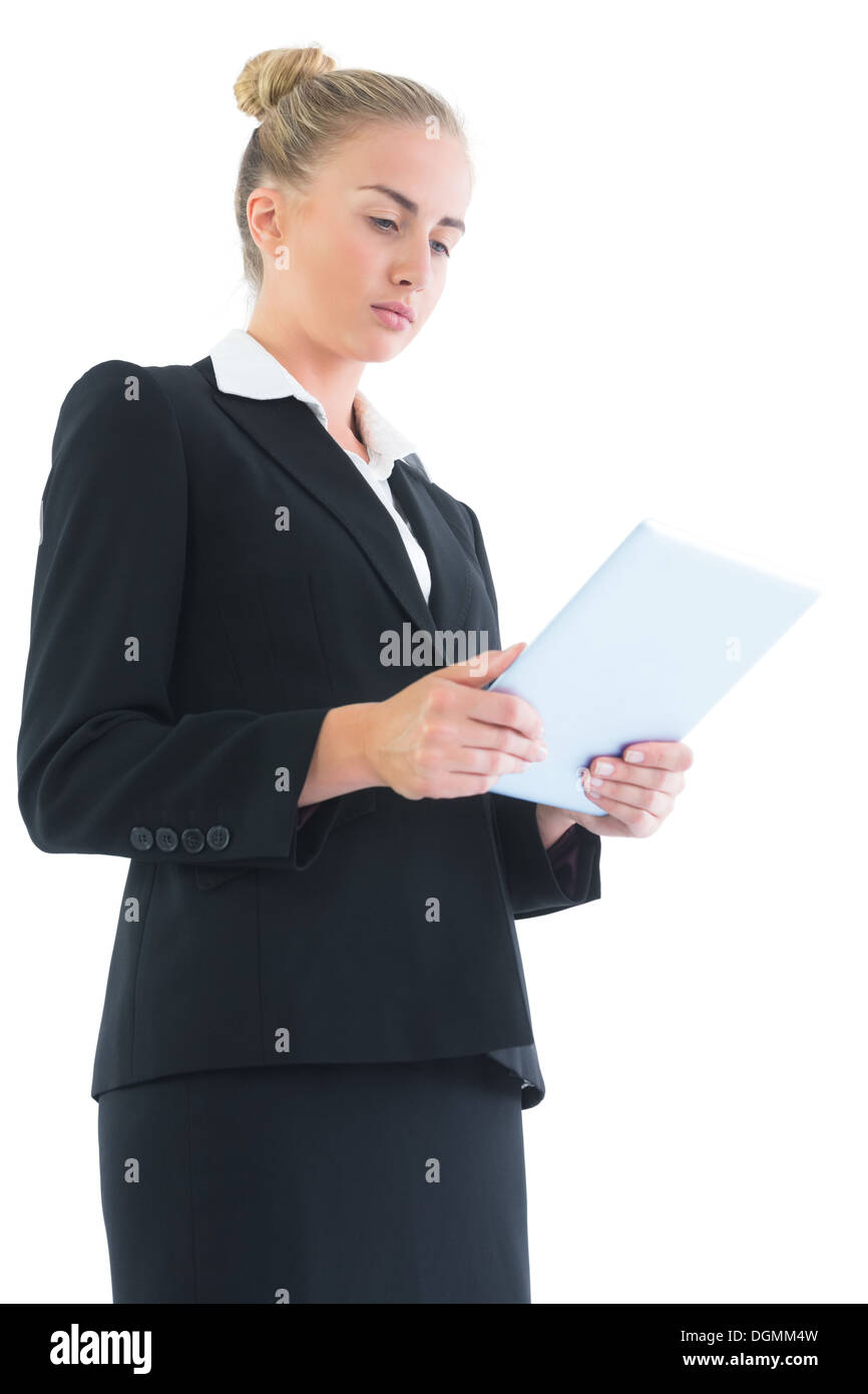 Low angle side view of blonde young woman using her tablet Stock Photo ...