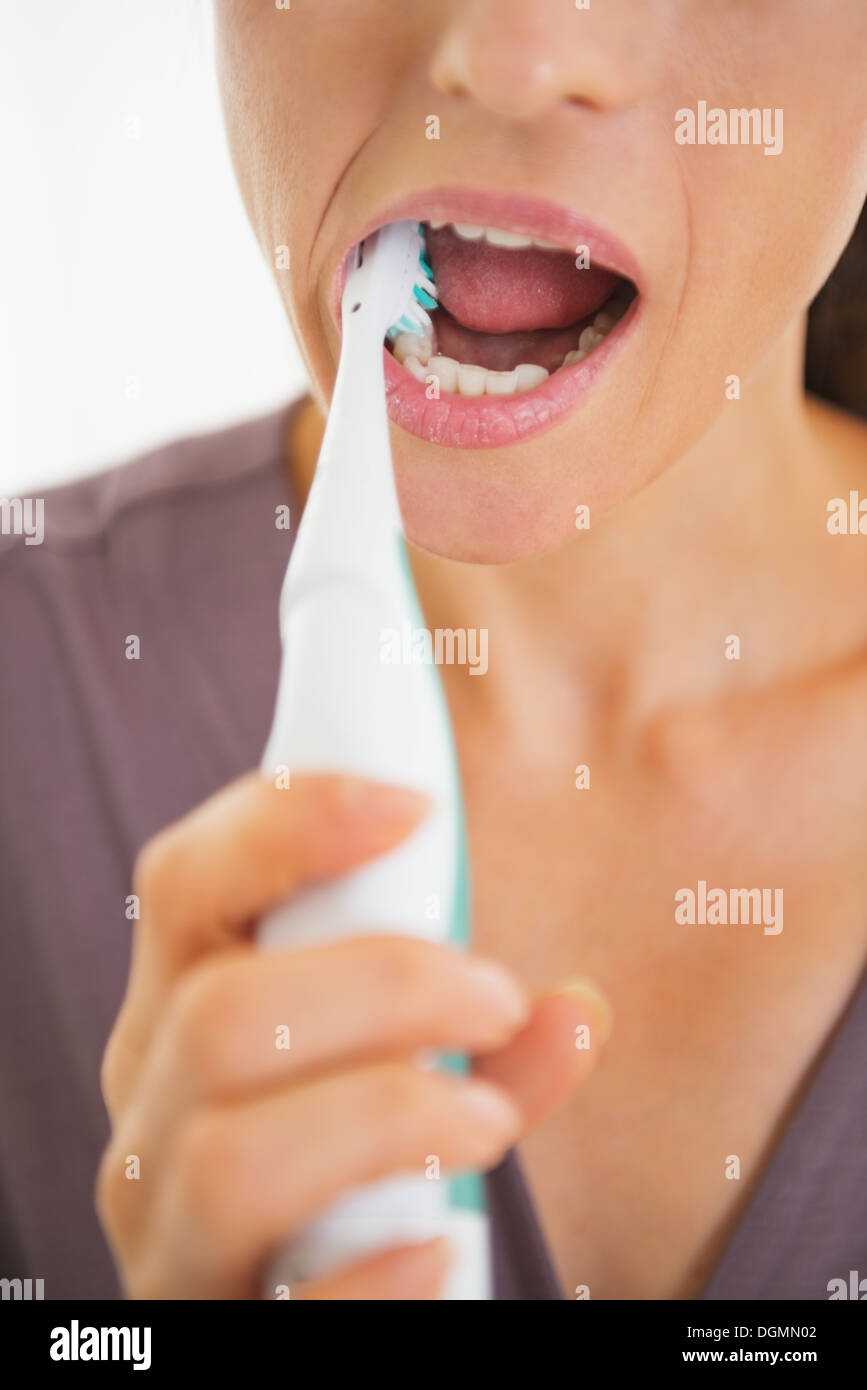 Closeup on young woman brushing teeth Stock Photo - Alamy