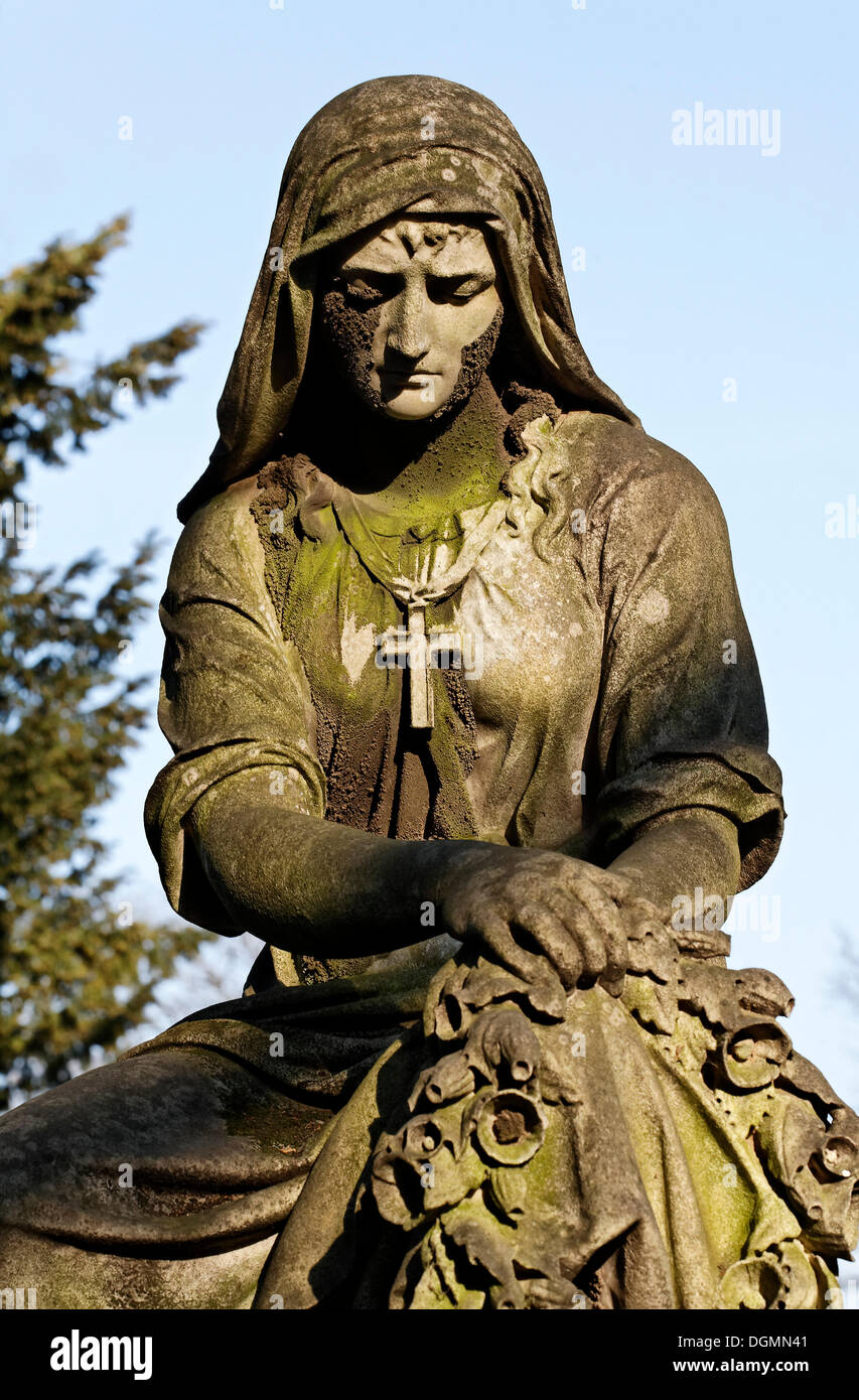 Sculpture grieving woman weathered historic hi-res stock photography ...