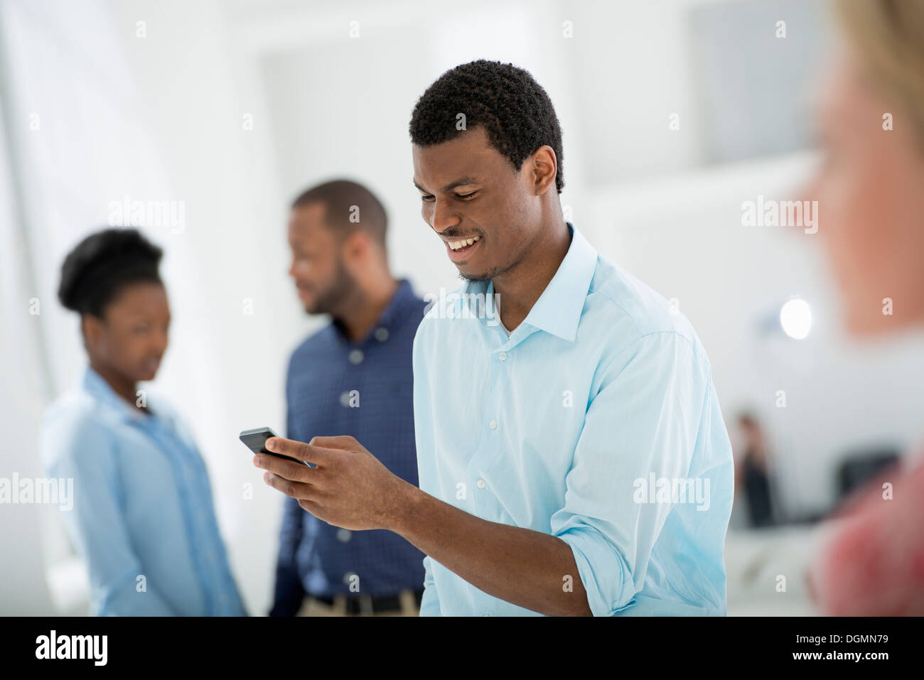 Group of people sitting with phone hi-res stock photography and images ...
