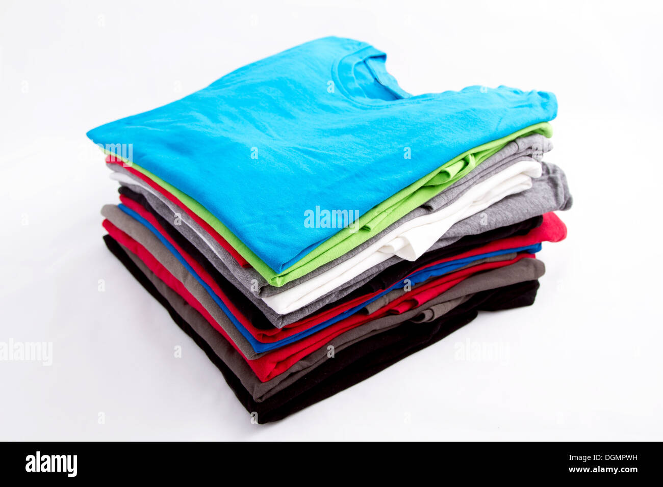 A pile of folded T shirts Stock Photo - Alamy
