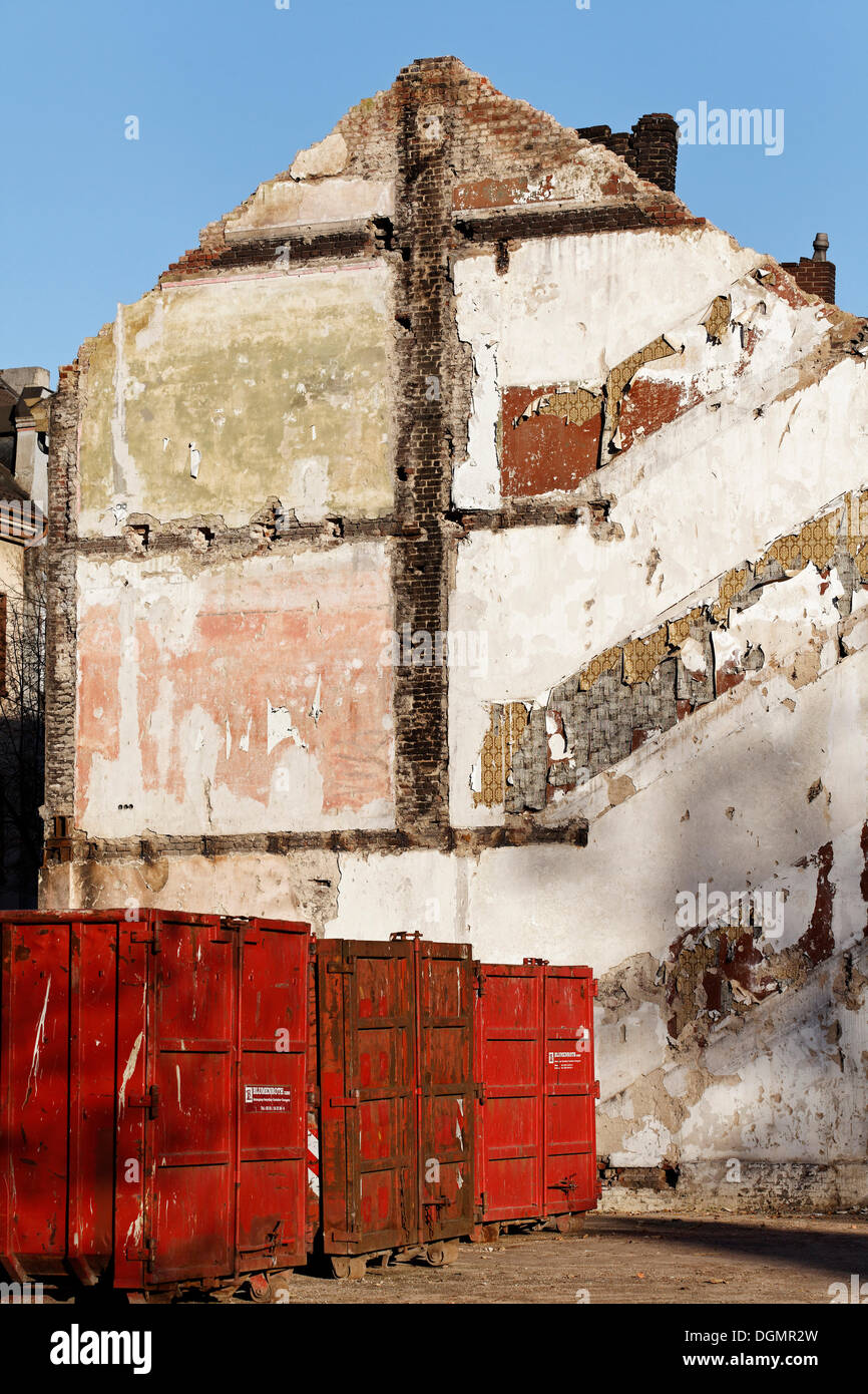 Containers for construction debris in front of a house marked for ...