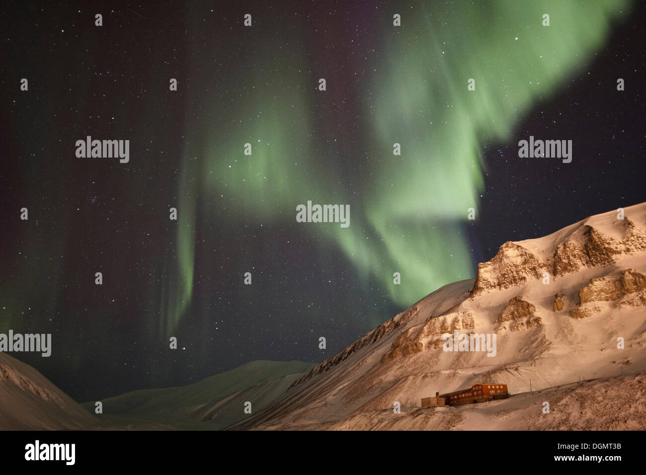 Strong green Northern Lights, Aurora Borealis, above a historic ...