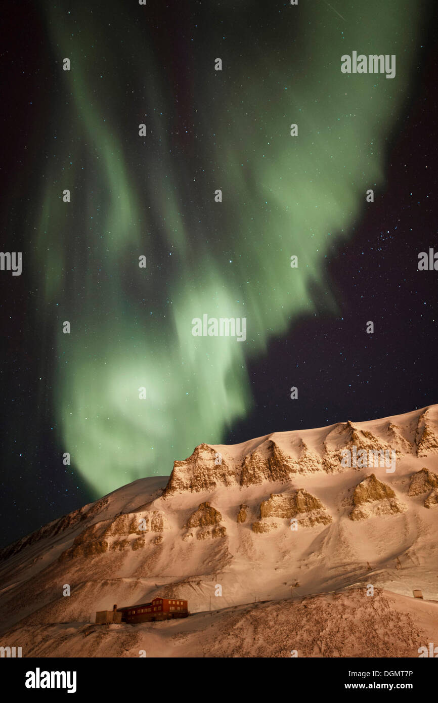 Strong green Northern Lights, Aurora Borealis, above a historic ...