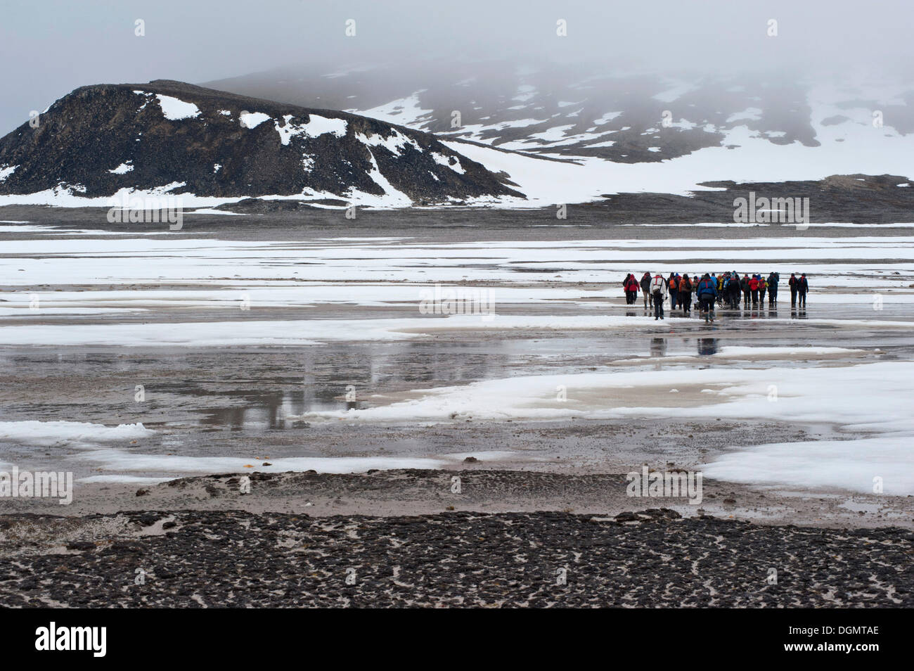 Visitors walking on Phippsøya, one of the northernmost islands of ...