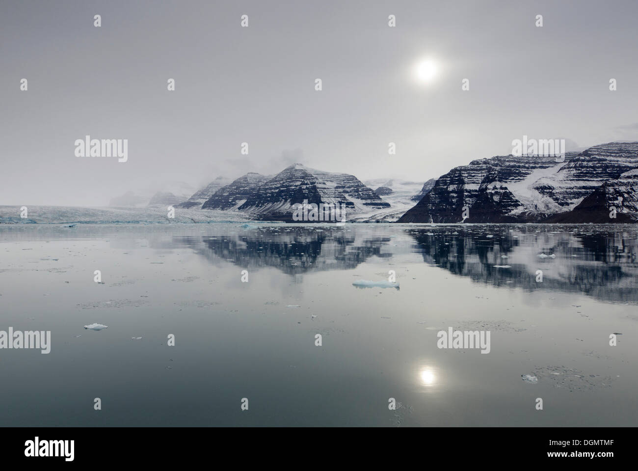 Perfect reflection of mountains and glacial scenery in the pale ...