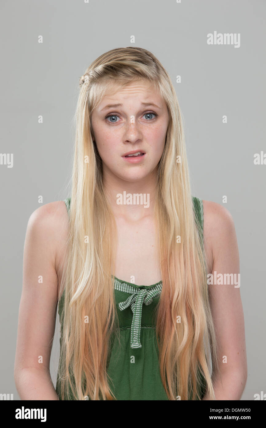 Portrait of teenage girl (14-15) making a face Stock Photo - Alamy