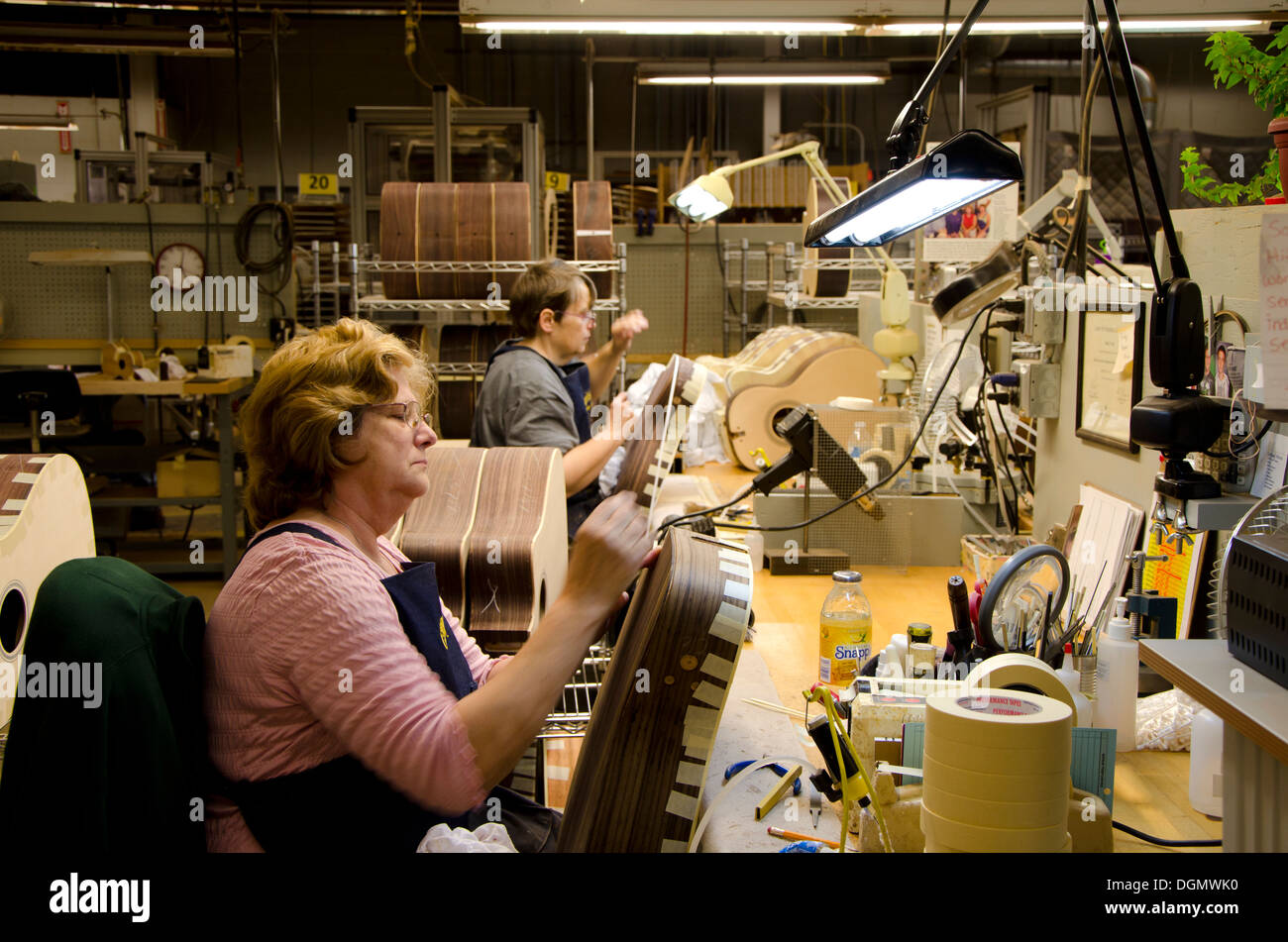 To women gluing the body together during production process at Martin ...