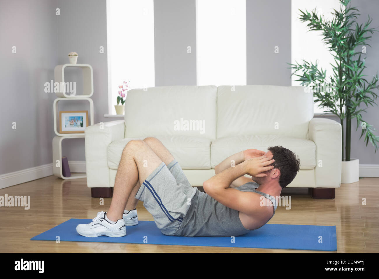 Handsome sporty man doing sit ups Stock Photo - Alamy