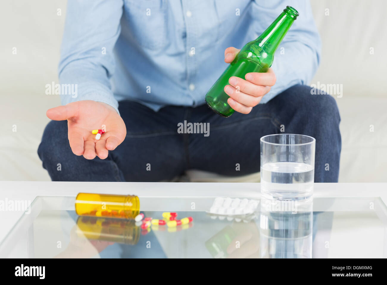 Man holding beer glass bottle hi-res stock photography and images - Alamy