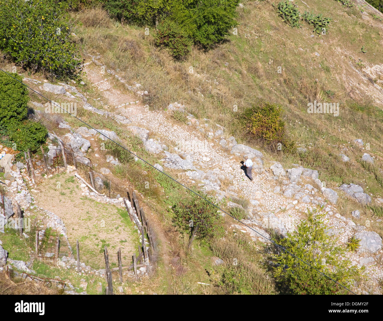 Man walking along ancient cobbled footpath track Grazalema, Cadiz ...