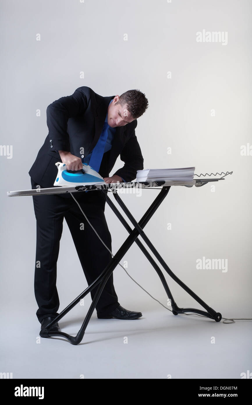 business man ironing out paperwork, keeping good documentations Stock ...