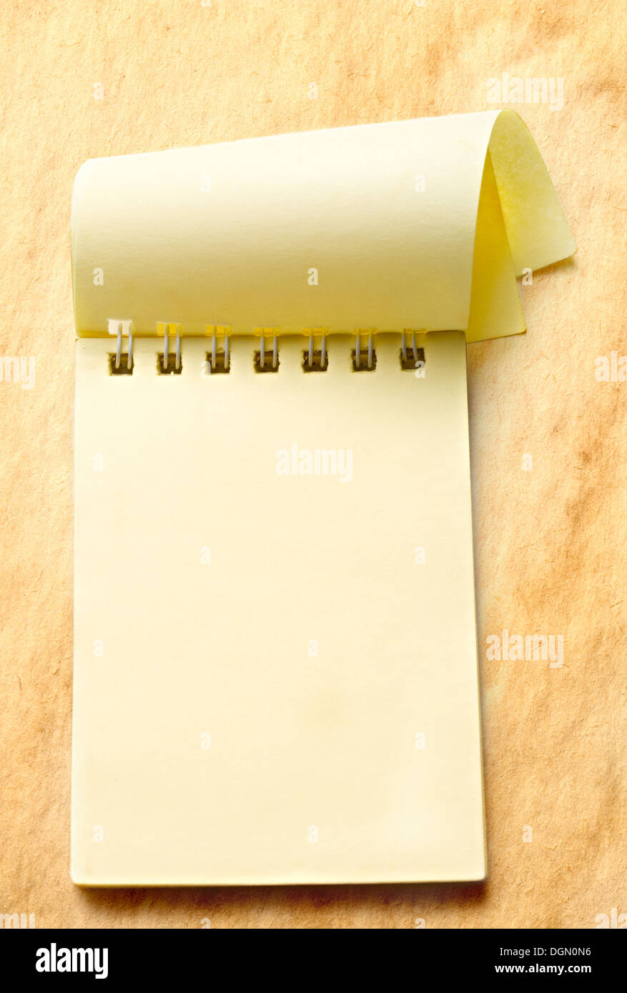 Notepad on aged paper background Stock Photo - Alamy