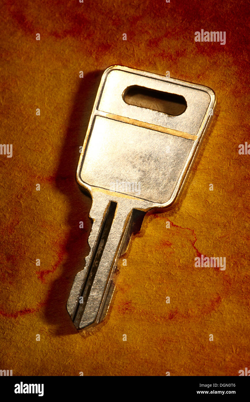 Metal key on iron background Stock Photo - Alamy