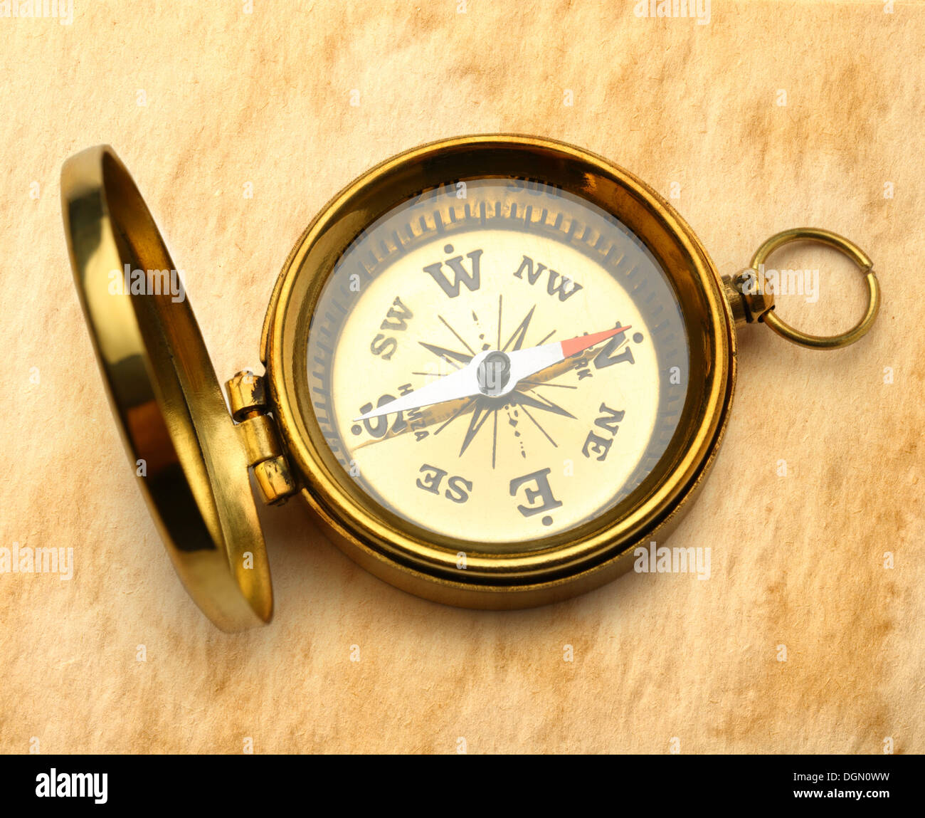 Golden compass on stained paper Stock Photo - Alamy