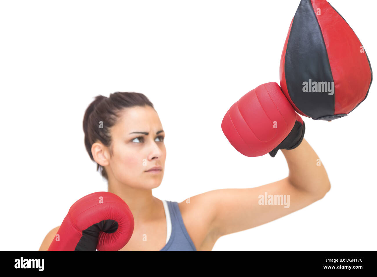 Serious sporty brunette training with punching bag Stock Photo - Alamy