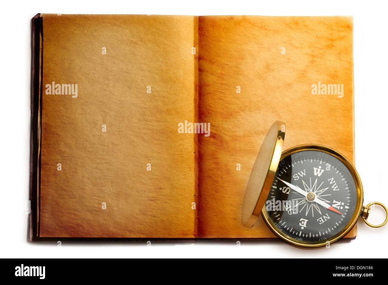 Single golden compass on book background Stock Photo - Alamy