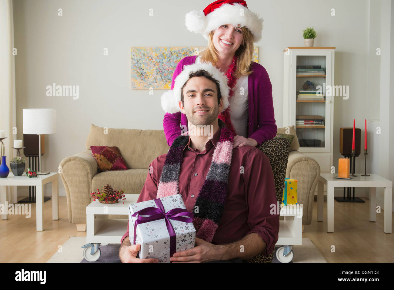 People wearing santa hats hi-res stock photography and images - Alamy