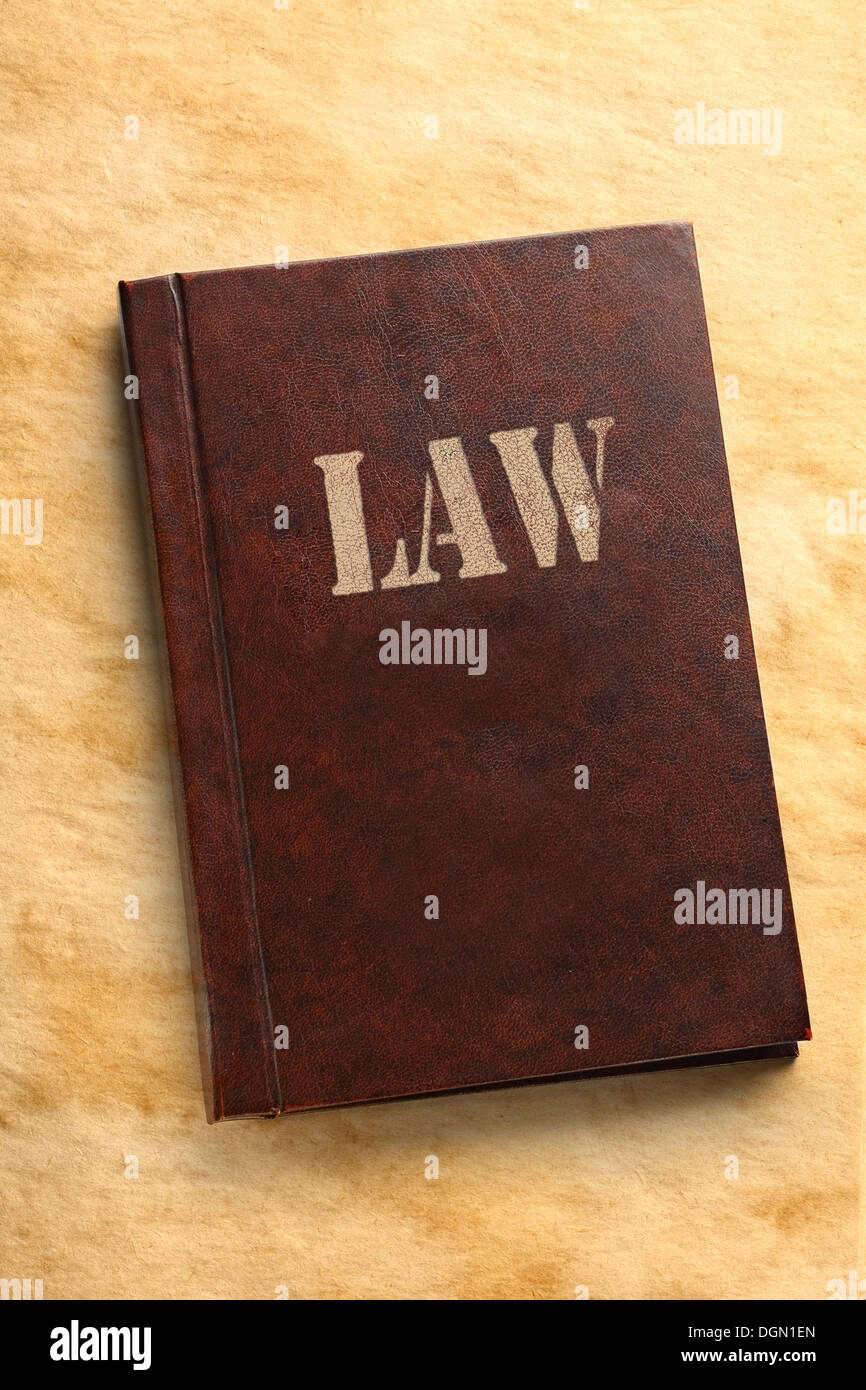 Law book on paper background Stock Photo - Alamy