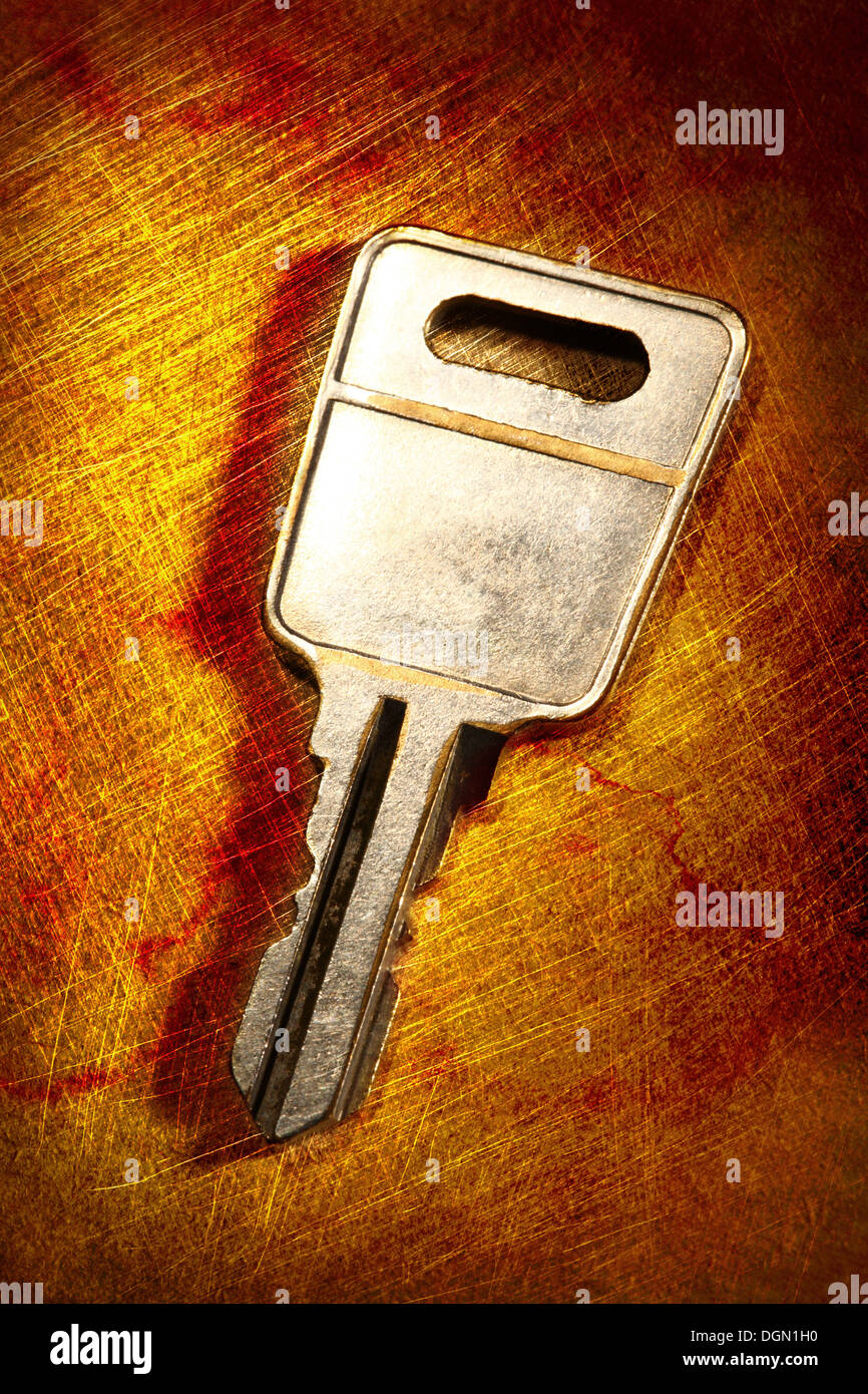 Metal key on iron background Stock Photo - Alamy
