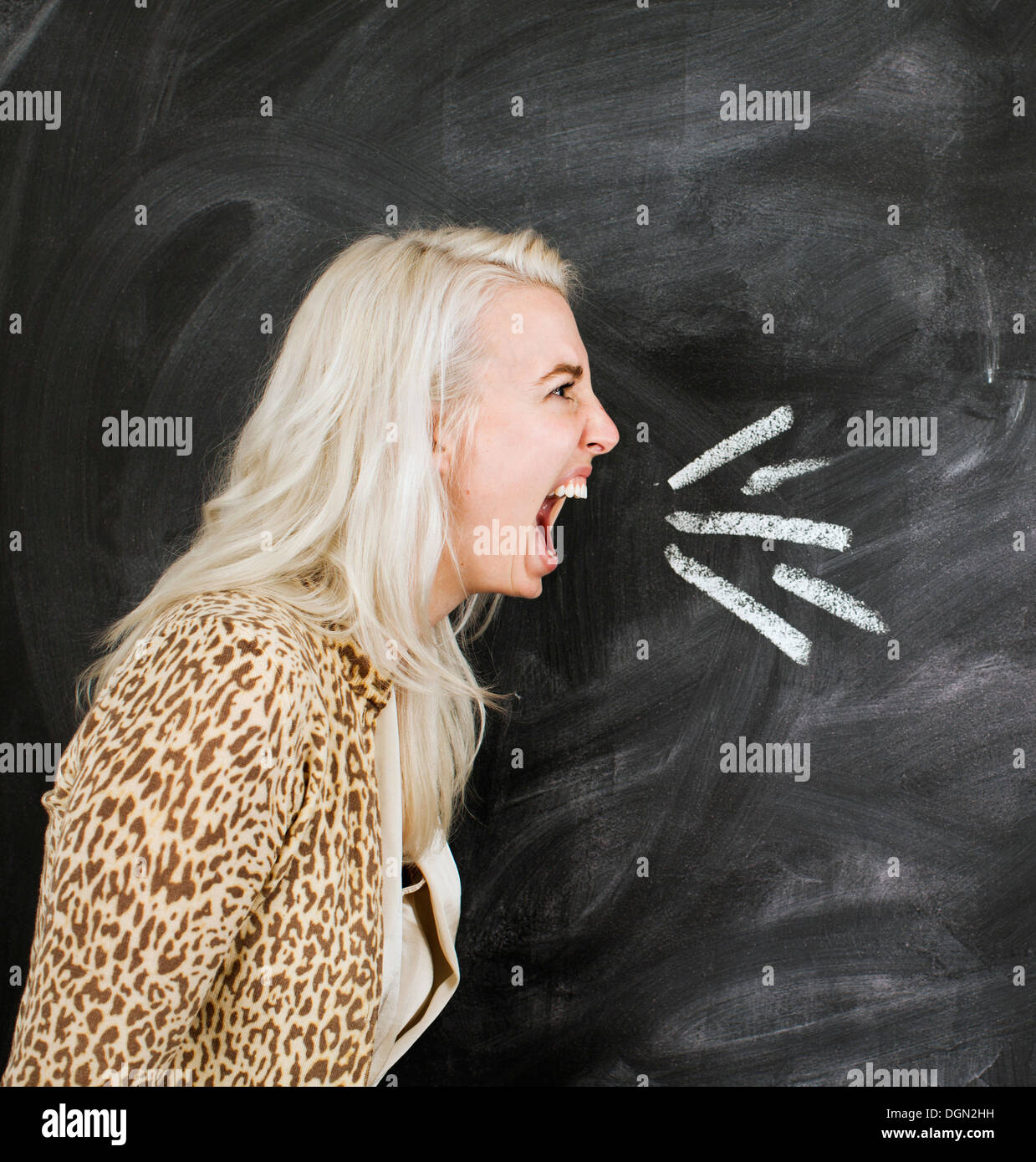 Studio portrait of young woman shouting Stock Photo - Alamy