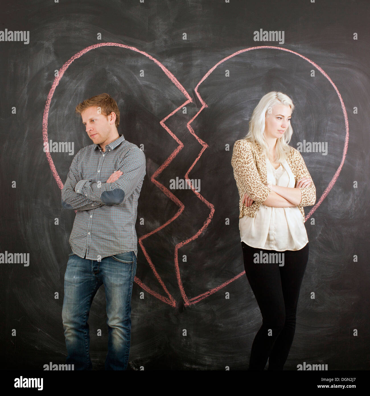 Studio portrait of separated couple Stock Photo - Alamy