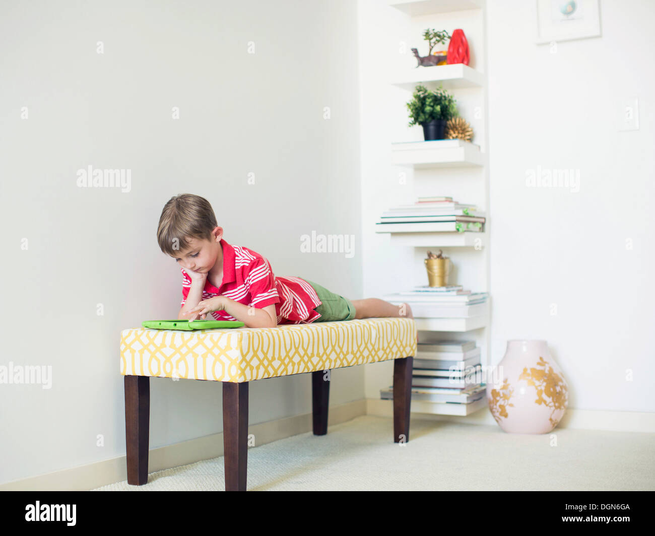 Boy lying down on bench hi-res stock photography and images - Alamy