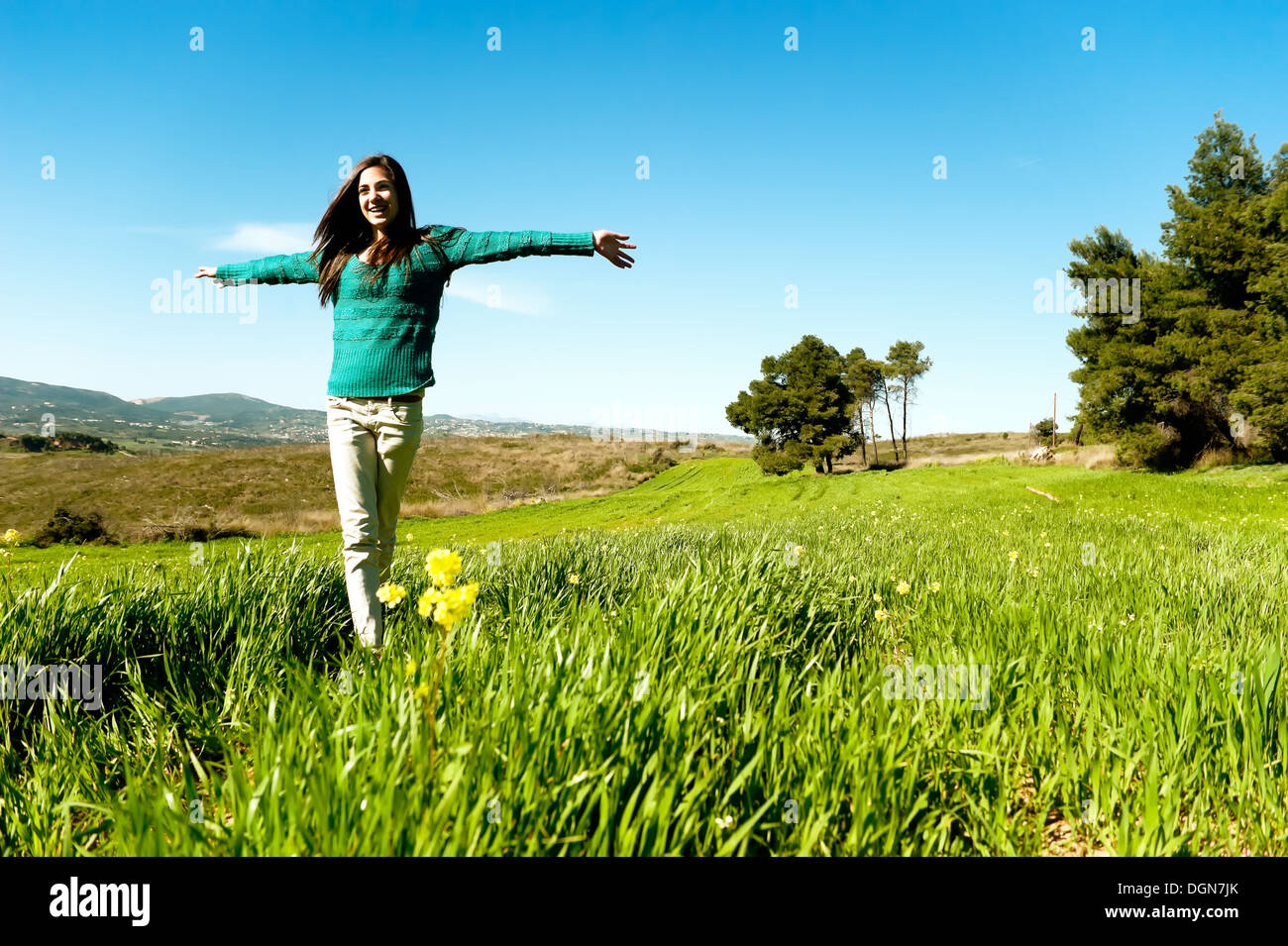 Teenage girl enjoying springtime in the field Stock Photo - Alamy