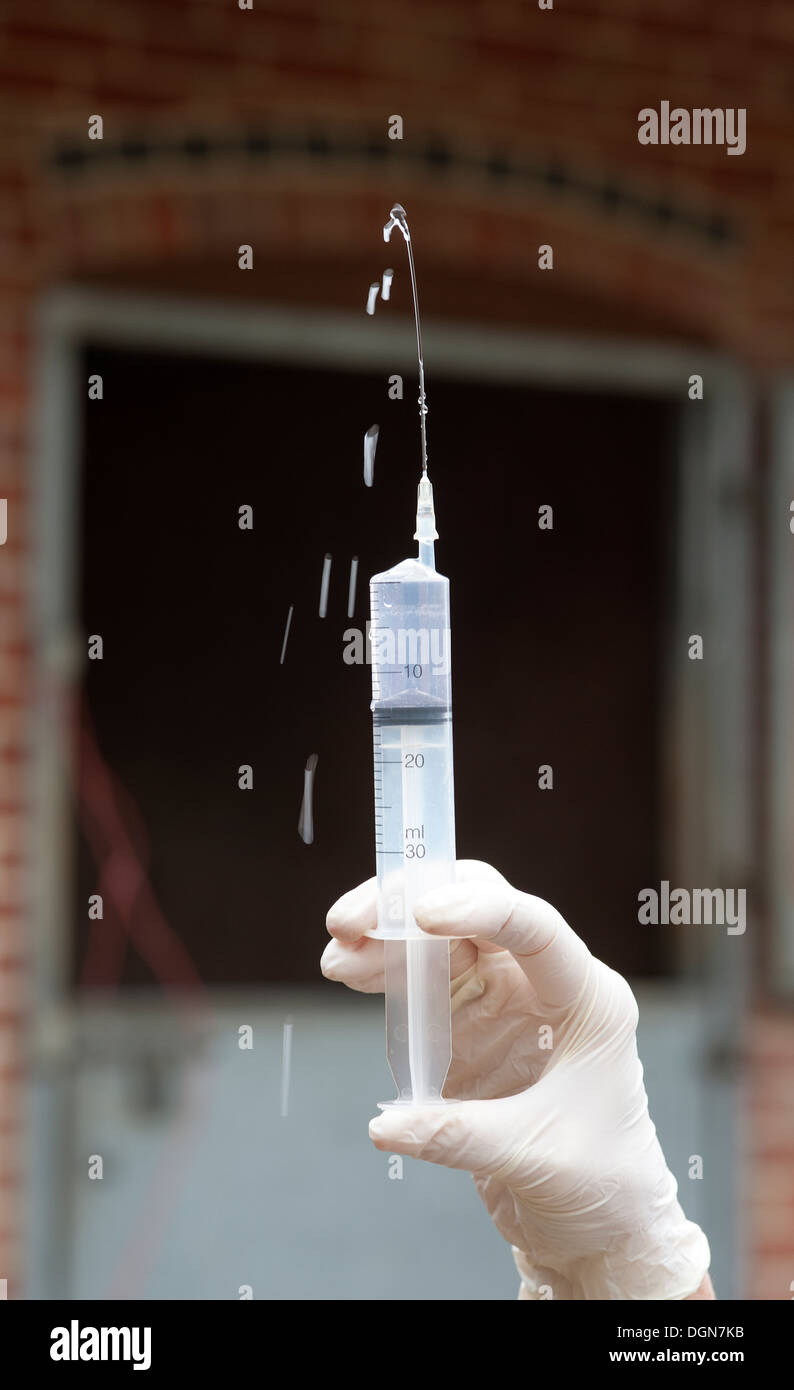 Medical syringe fluid flow check Stock Photo - Alamy