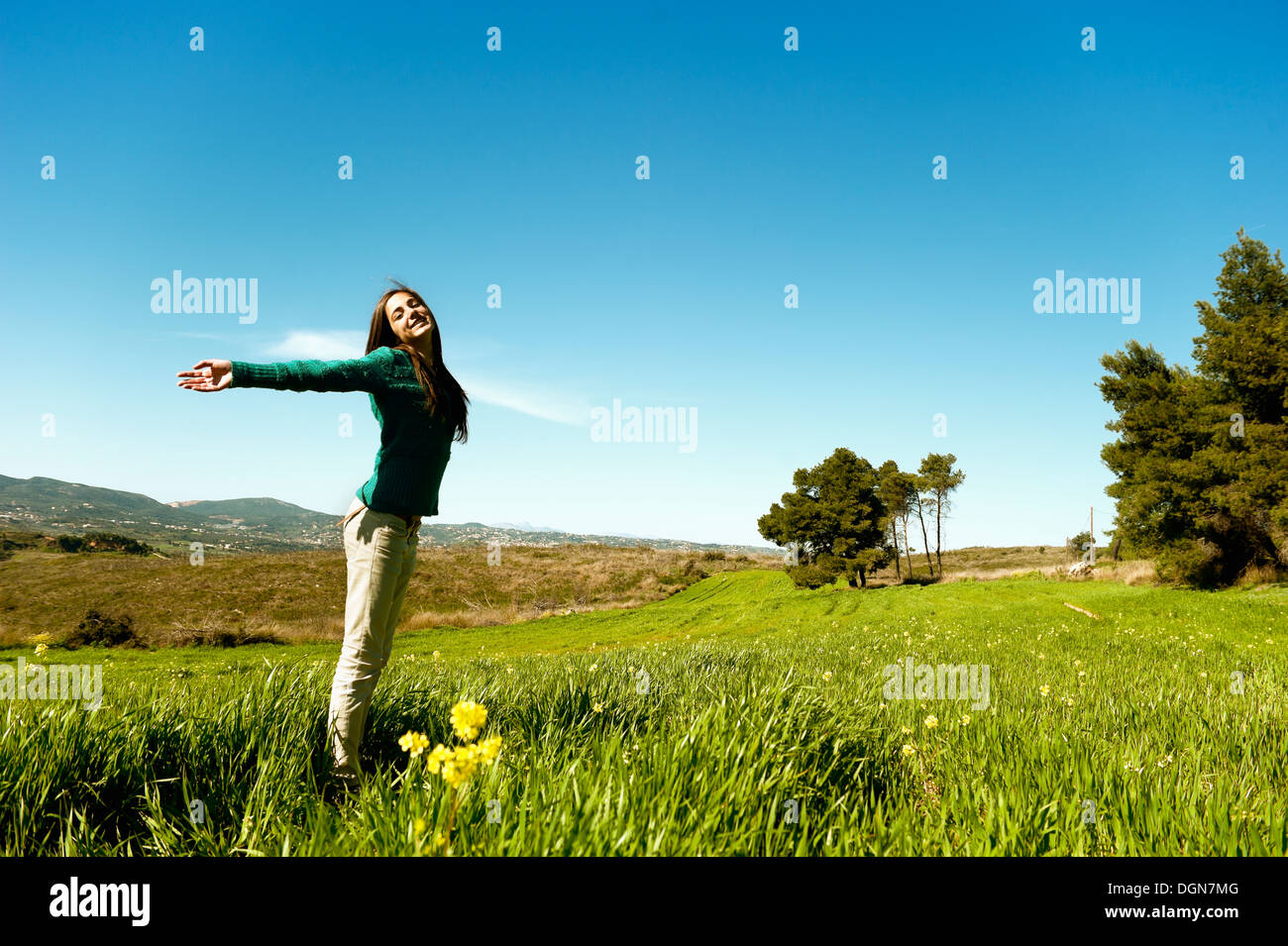 Teenage girl enjoying springtime in the field Stock Photo - Alamy
