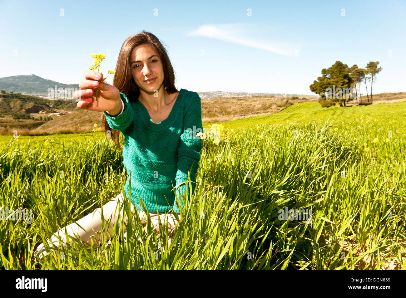 Teenage girl enjoying springtime in the field Stock Photo - Alamy