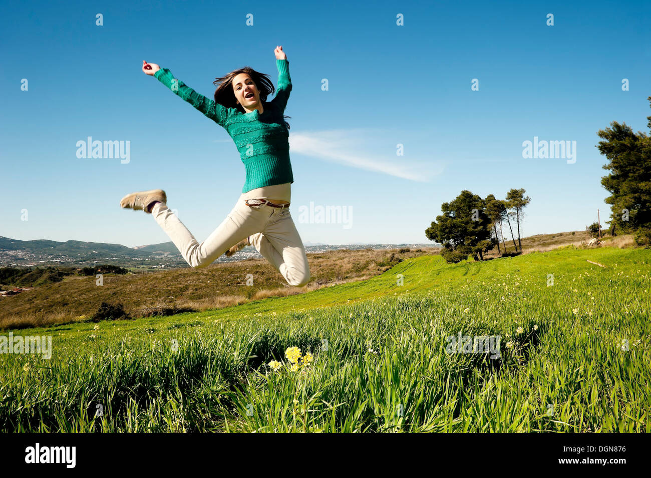 Teenage girl enjoying springtime in the field Stock Photo - Alamy