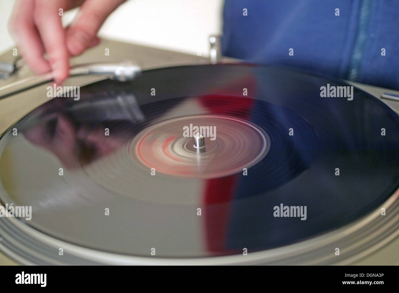 A DJ playing a record on a turntable, close up Stock Photo - Alamy