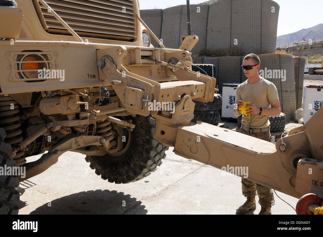 U.S. Army Spc. Troy Allred, of Fort Worth, Texas, prepares a disabled ...
