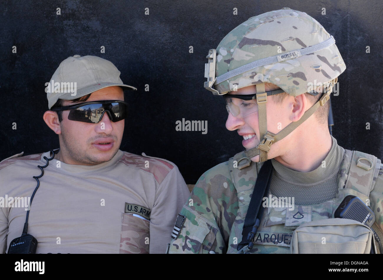 U.S. Army Pfc. Hector Marquez speaks with an Afghan Security Guard ...